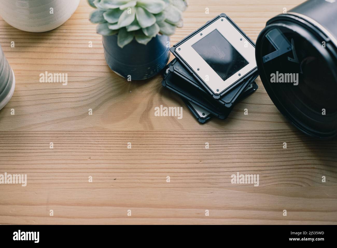 Camera lens and photographic slides for film projector Stock Photo - Alamy