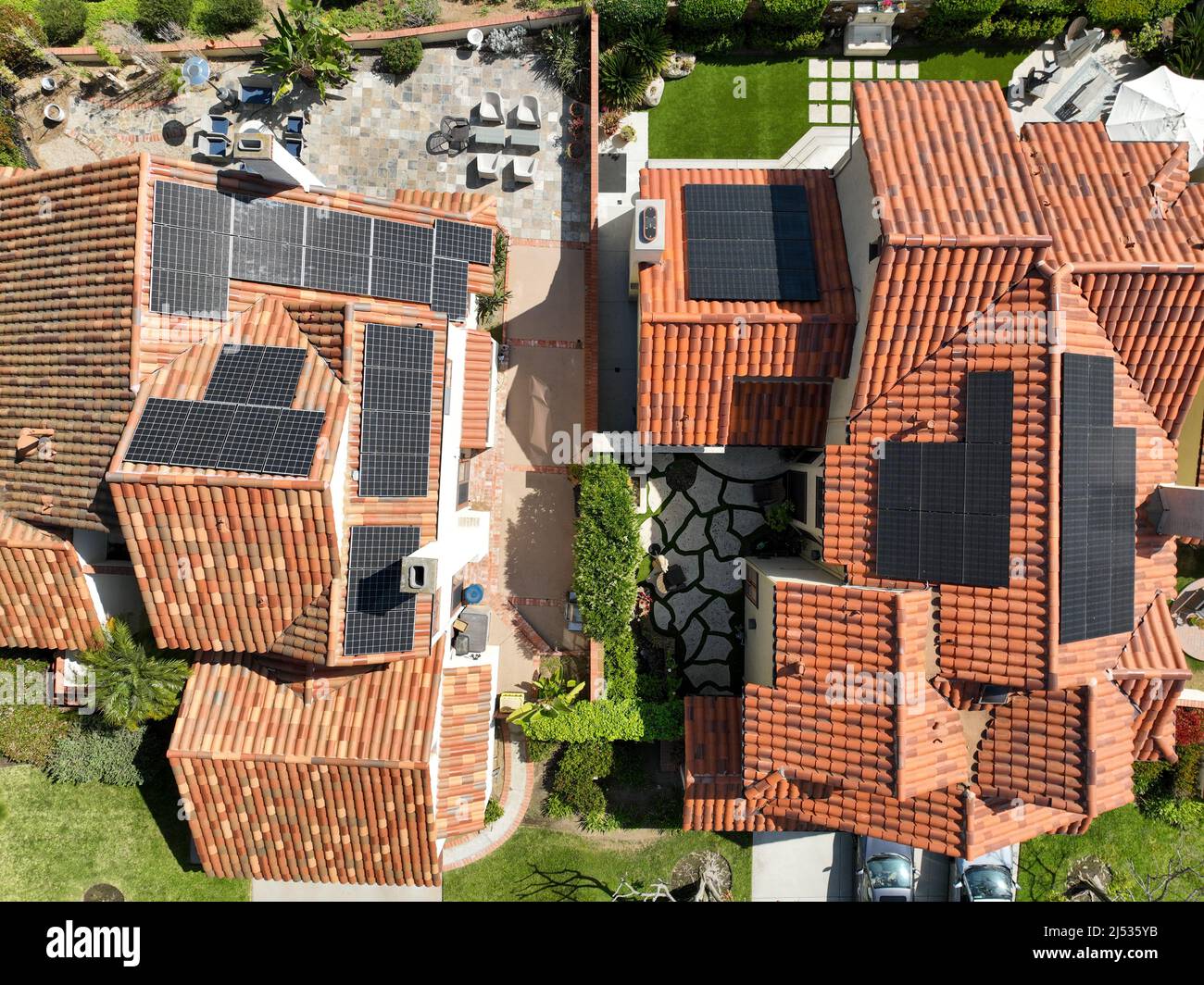 Aerial top view of residential villas with solar panel on the roof, San ...