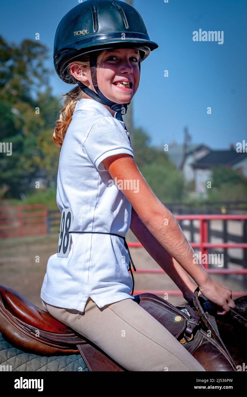 Young girl on horseback, riding and jumping in Virginia equestrian ...