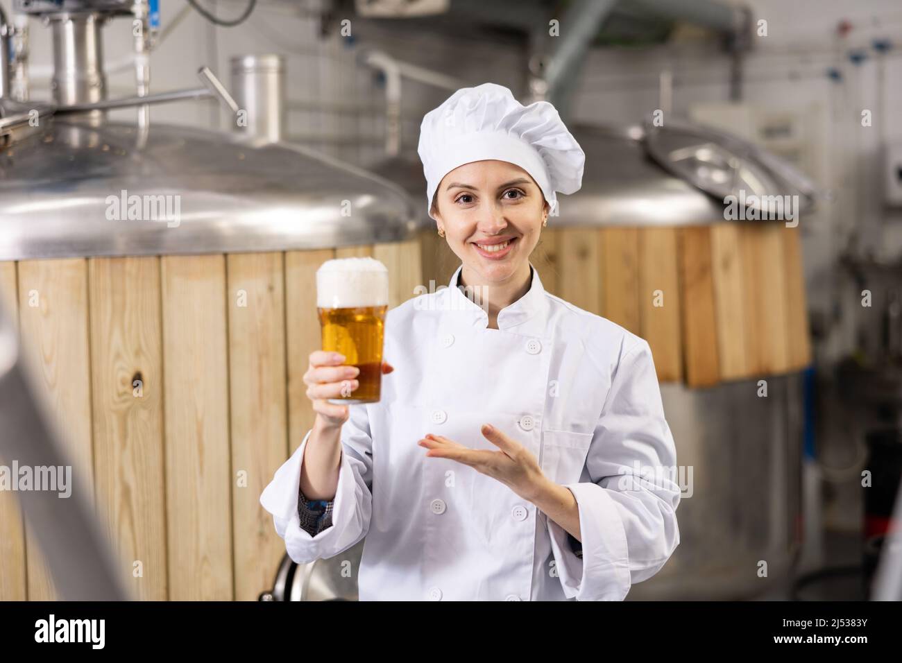 Cheerful female brewer holding hi-res stock photography and images - Alamy