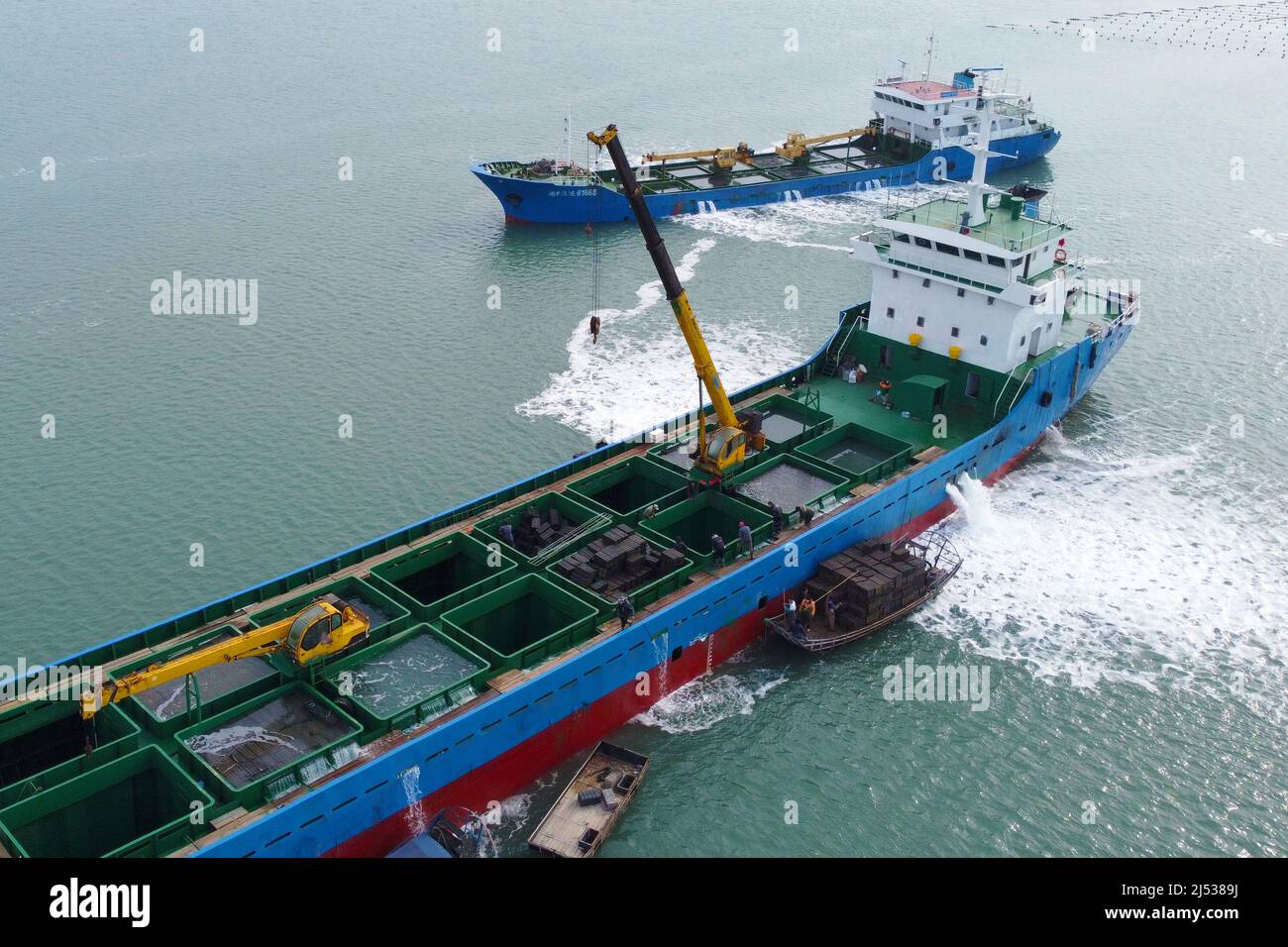 RONGCHENG, CHINA - APRIL 18, 2022 - Fishermen transfer abalone to a ...