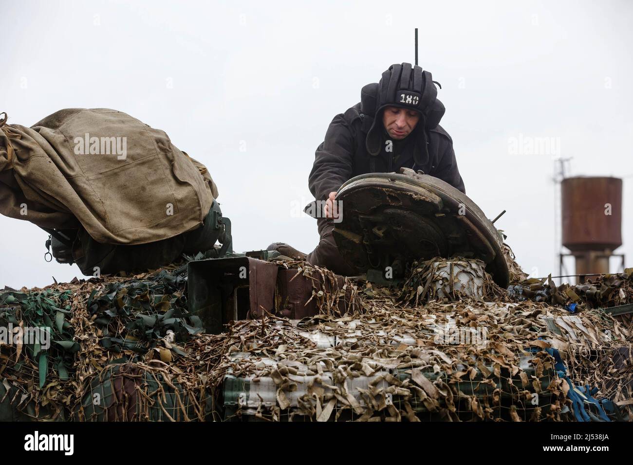 Armored units on combat duty. The tank man prepares the tank for ...
