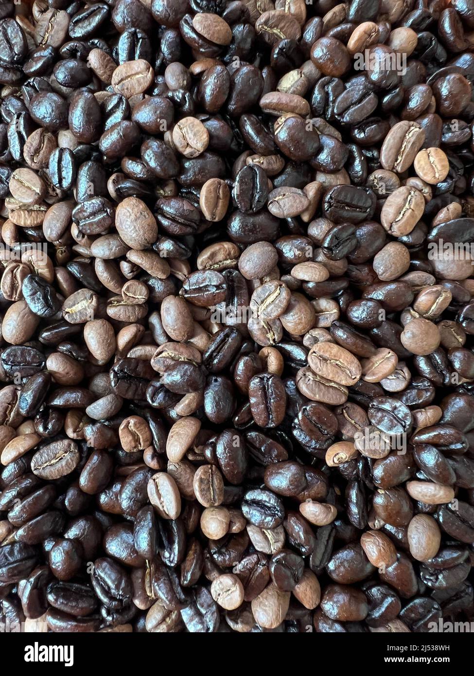 A mixture of light and dark roast organic coffee beans Stock Photo - Alamy