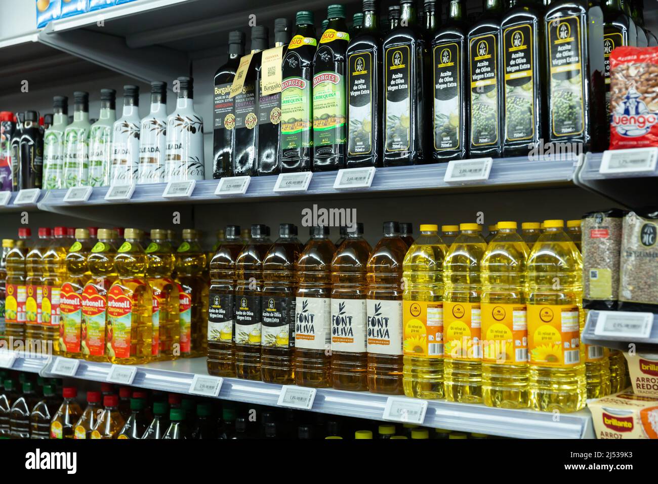 Variety of oil in grocery shop Stock Photo - Alamy