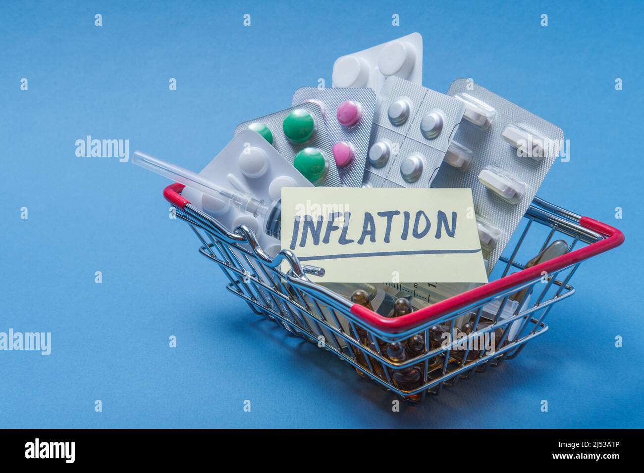 A basket with medical preparations in it on a blue background with ...