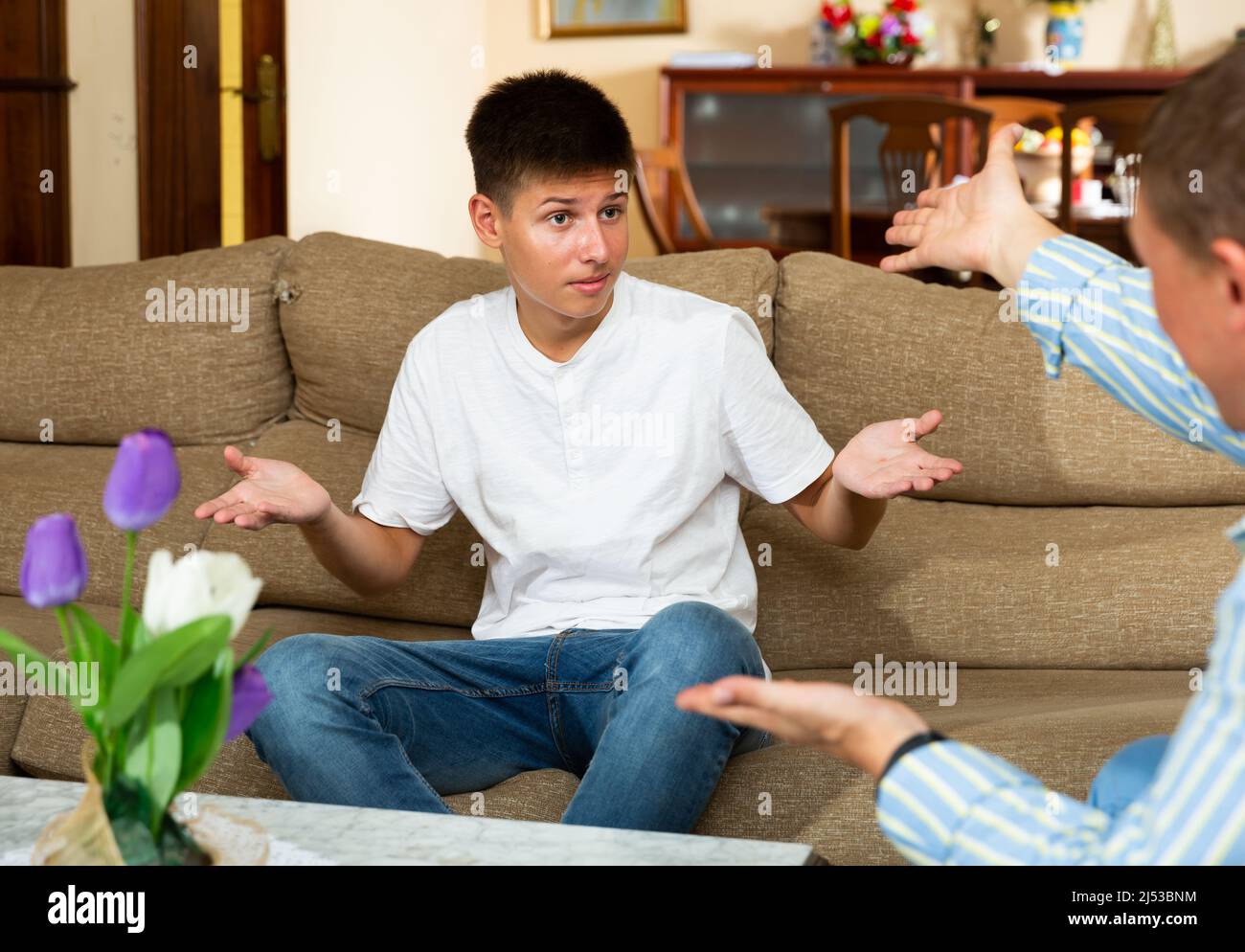 Teenager arguing with father Stock Photo - Alamy