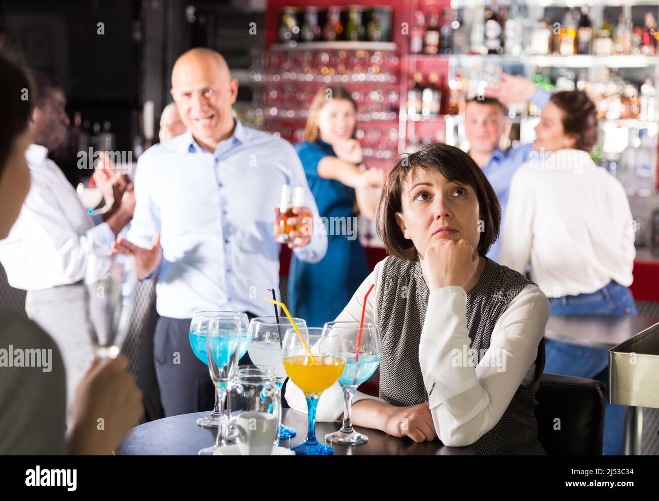 Bored woman at party Stock Photo - Alamy