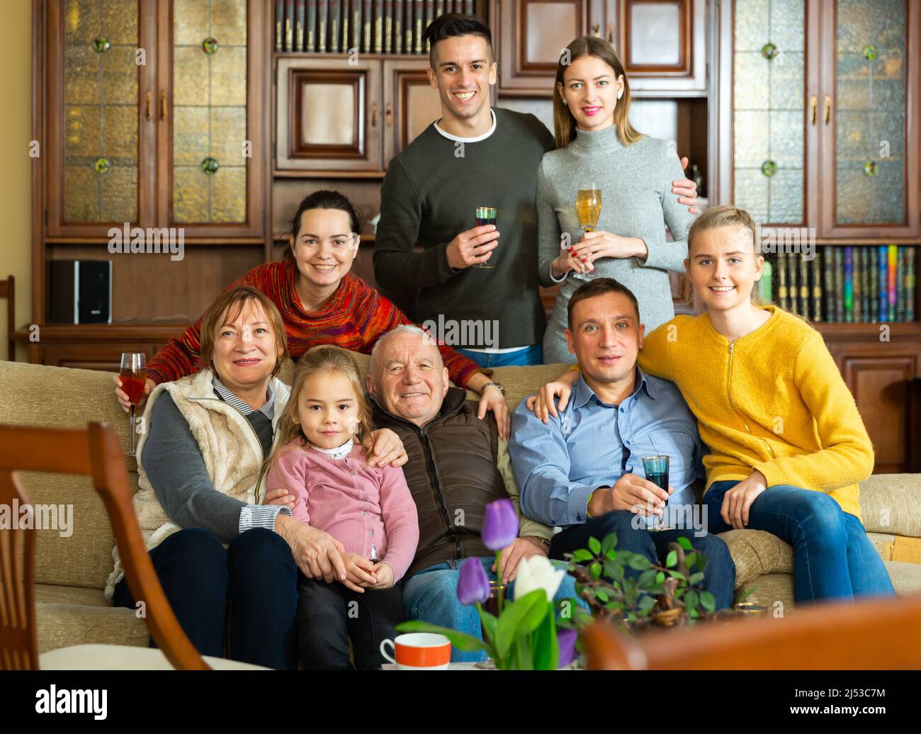 Happy large family gathered in parental home Stock Photo - Alamy