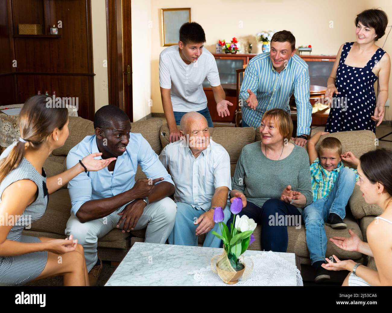Friendly family meeting Stock Photo - Alamy