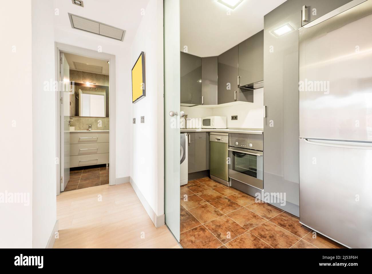 kitchen with sliding glass partition, gray furniture with integrated ...