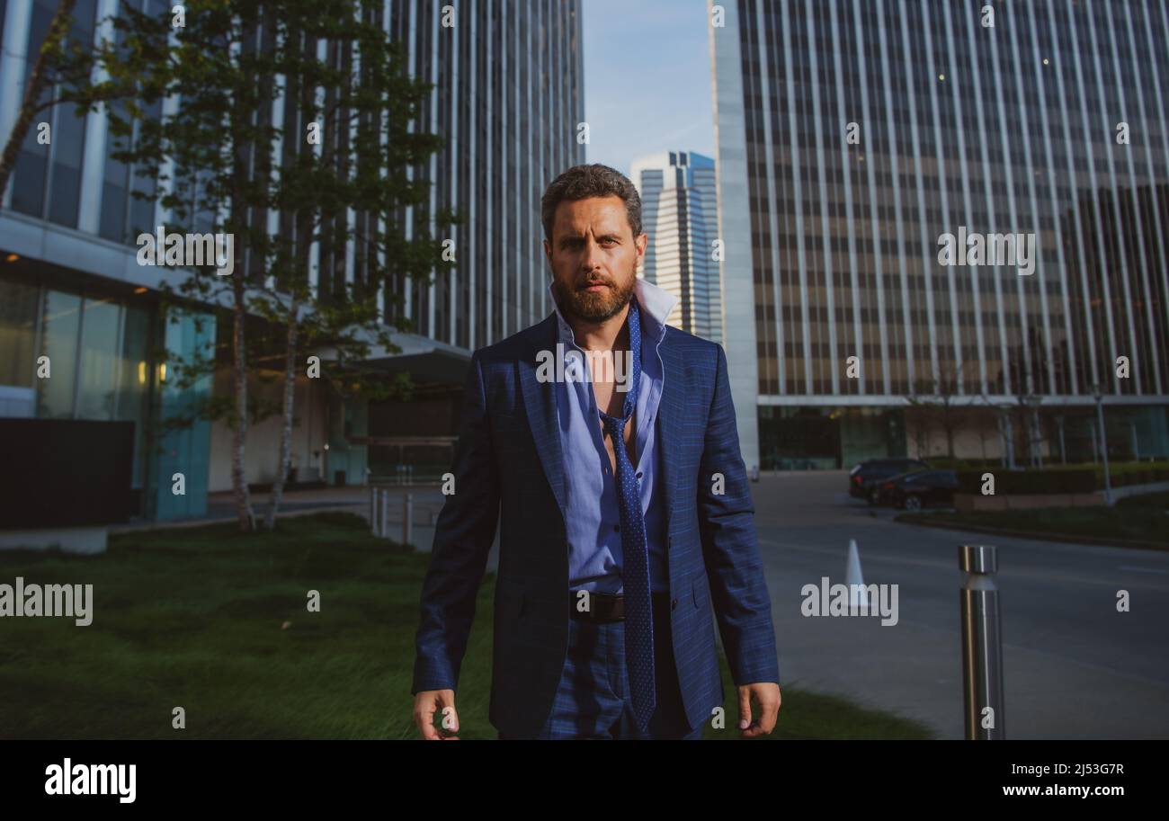 Tired business man after hard working day near office. Business concept ...