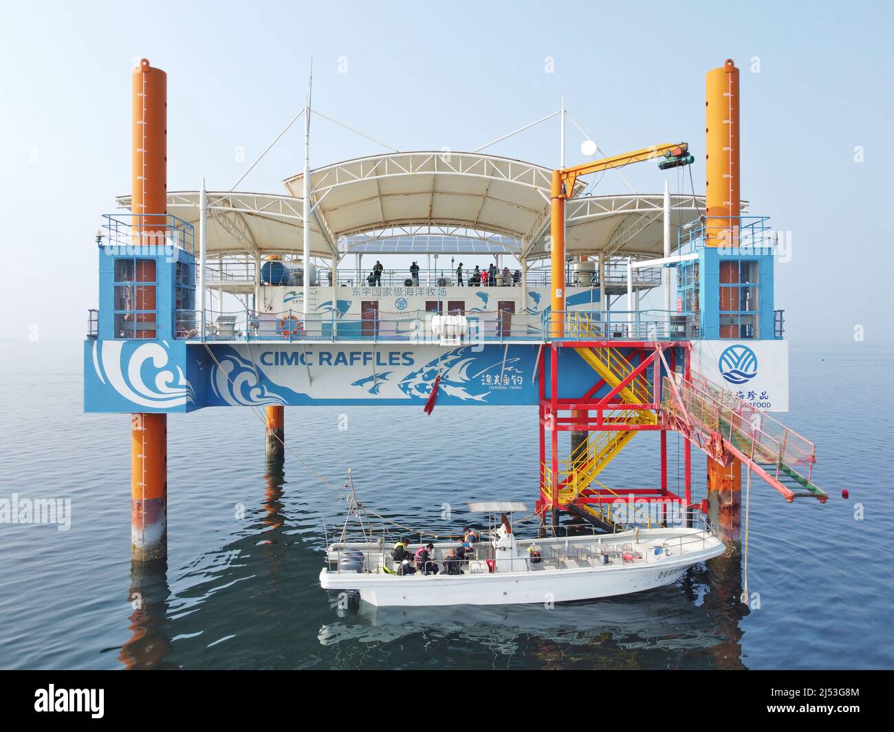 YANTAI, CHINA - APRIL 19, 2022 - Tourists visit a jack-up multi ...