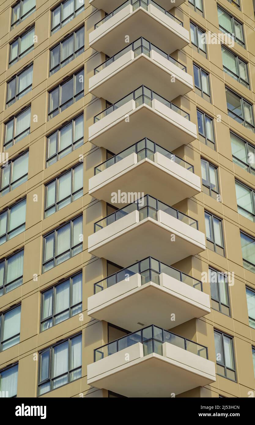 Facade detail of a modern high-rise apartment building. Abstract ...