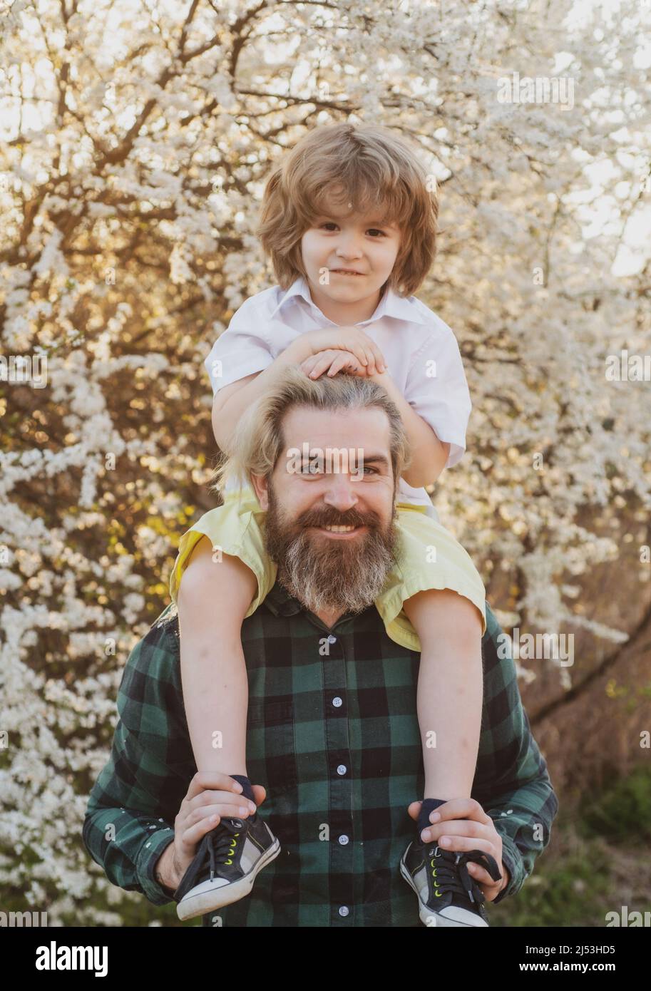 Fathers Day. Dad kid relationships. Child shoulder ride on dad. Son ...