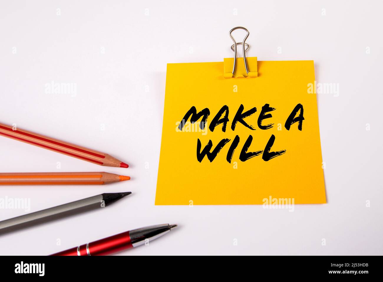 MAKE A WILL. Sheet of note paper and stationery on a white background ...