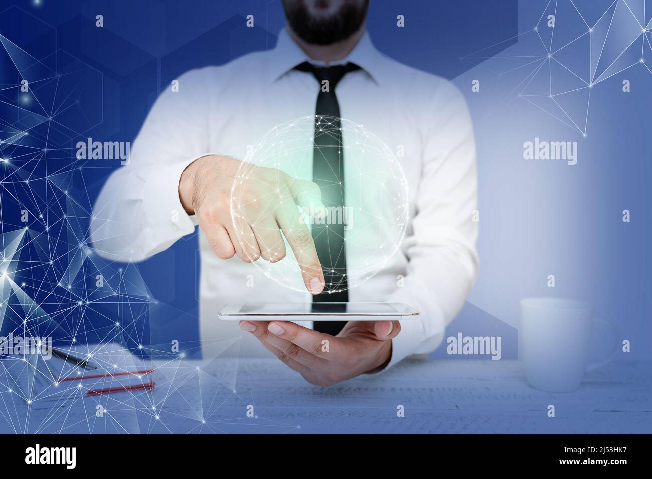 Businessman in suit pointing down tablet represents global innovative thinking accomplishing ...