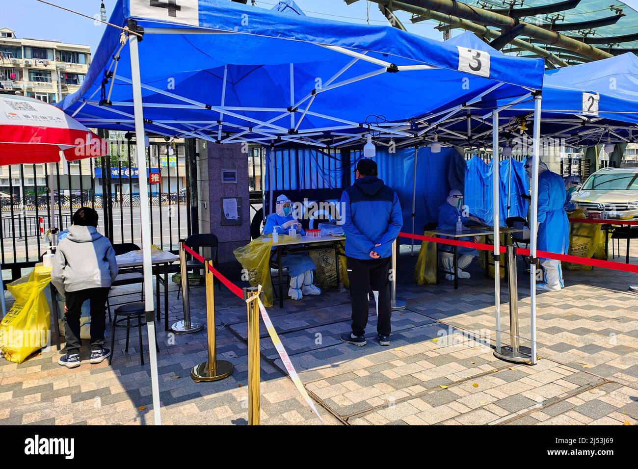 SHANGHAI, CHINA - APRIL 20, 2022 - Citizens take part in nucleic acid ...