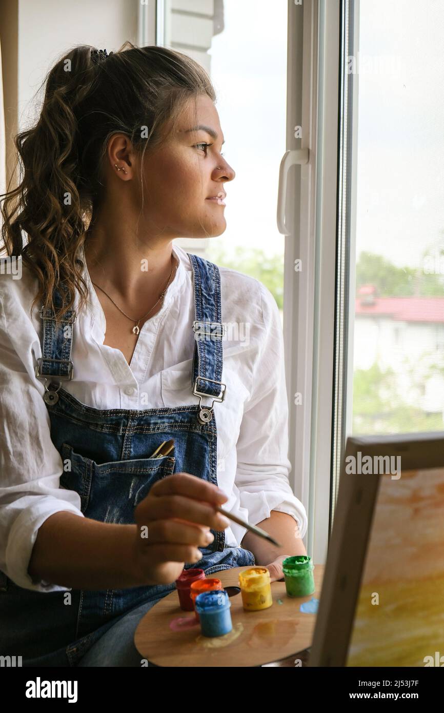 Creative painter in working process. Artist workplace, hobby, craft ...