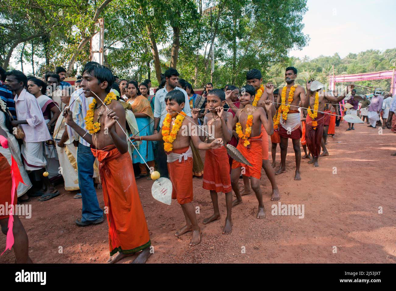 Young boys piercing spike through cheeks discharging vow in Thaipusam ...