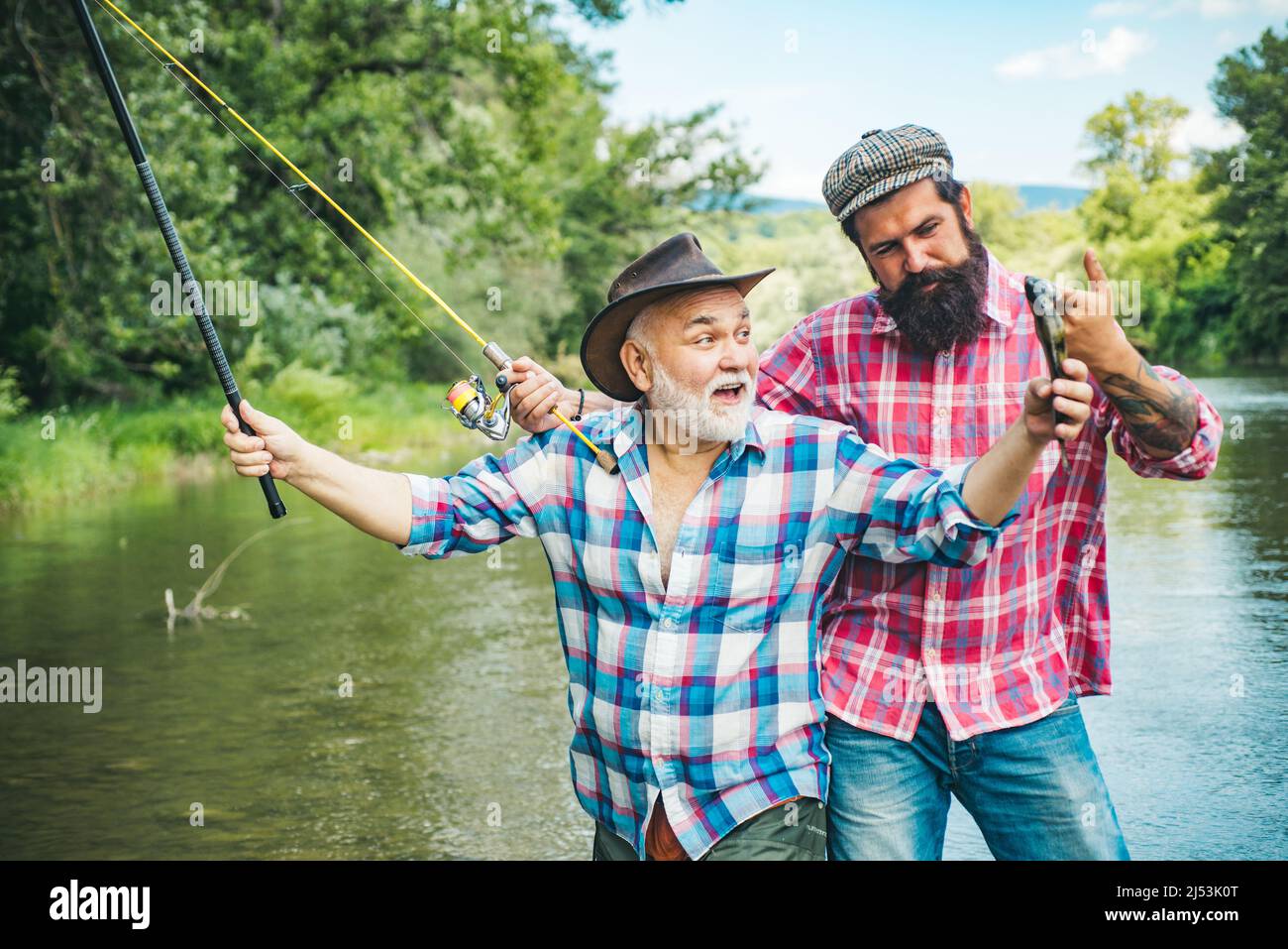 Happy excited man friends. Portrait of cheerful senior man fishing ...