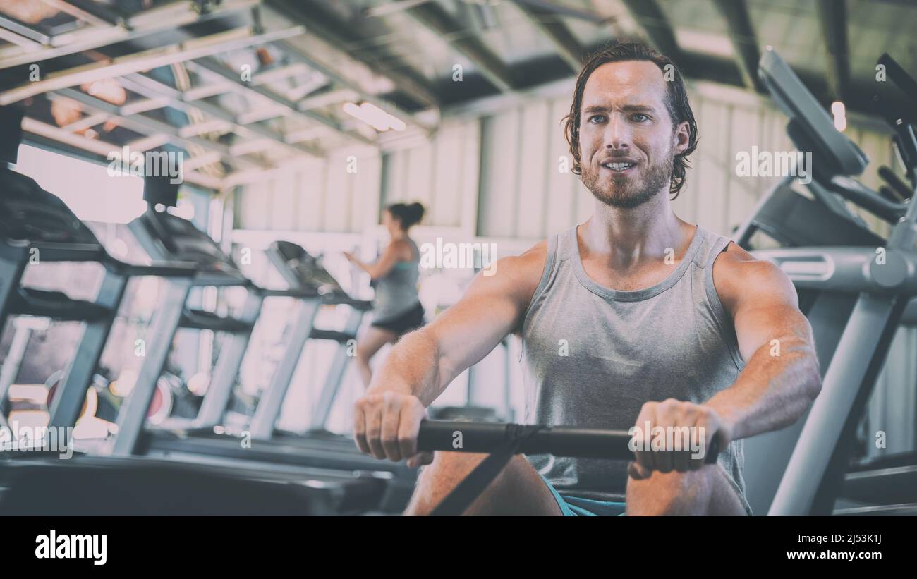 Fitness man training on rowing machine at gym Stock Photo - Alamy