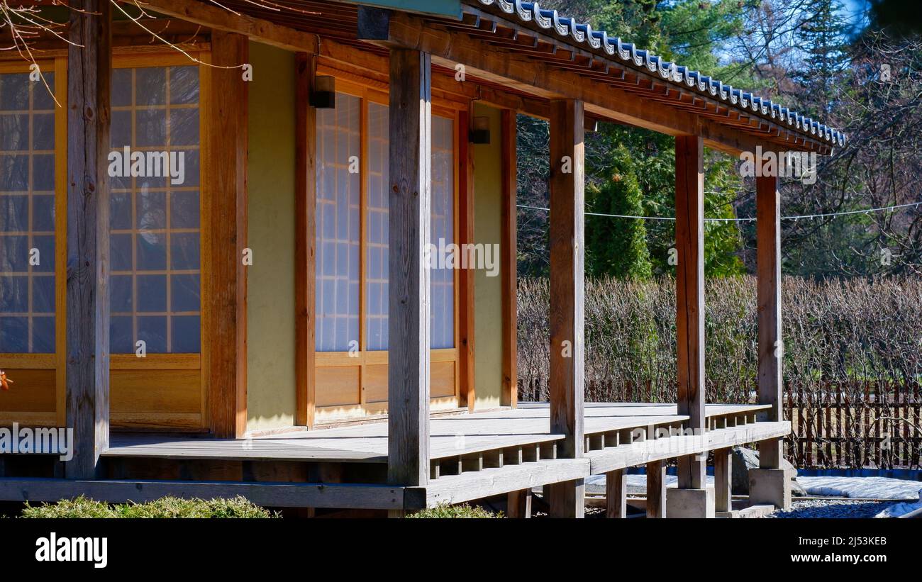 House with panoramic windows and a veranda in a traditional Japanese ...