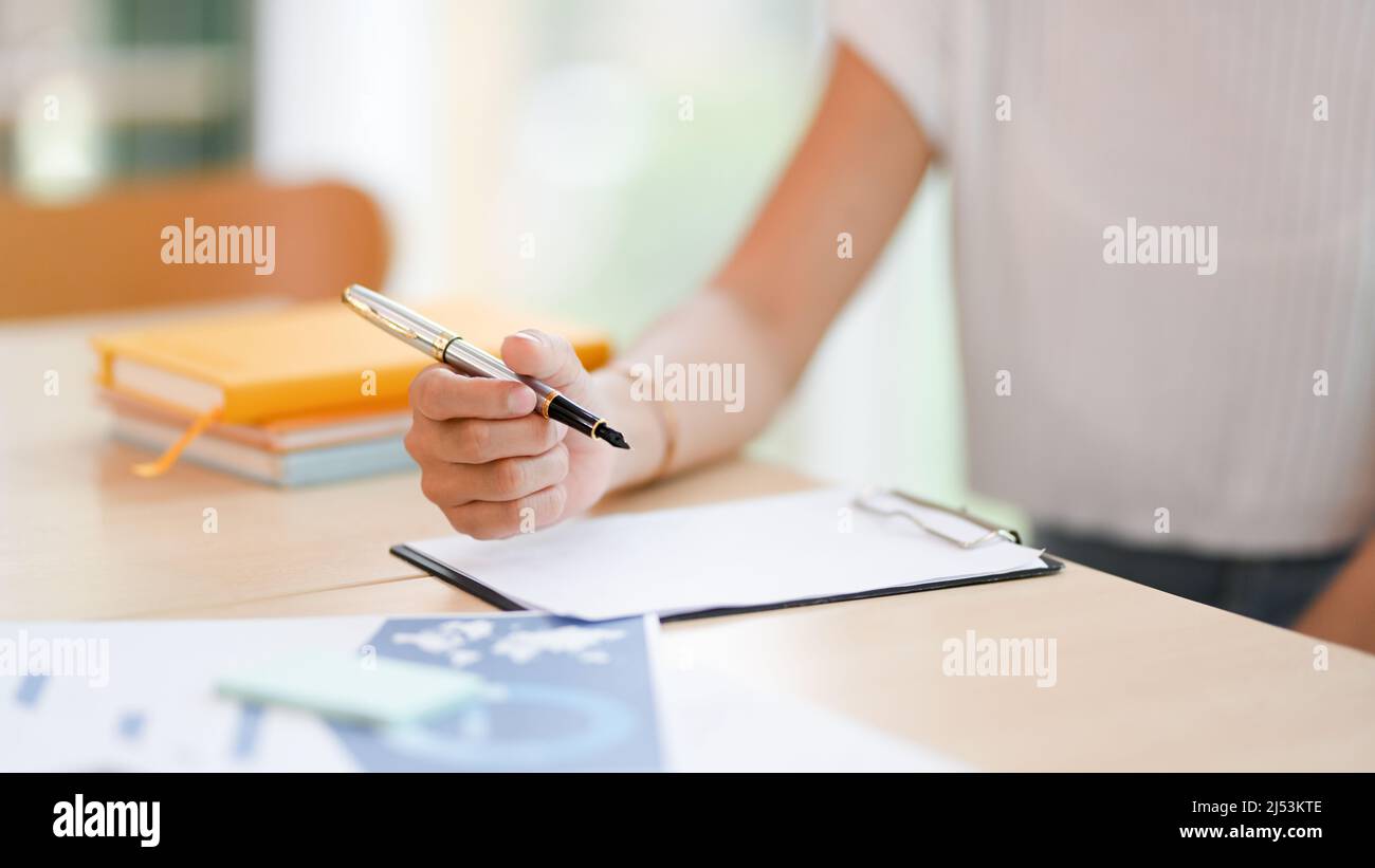 Staff hand over paper work hi-res stock photography and images - Alamy
