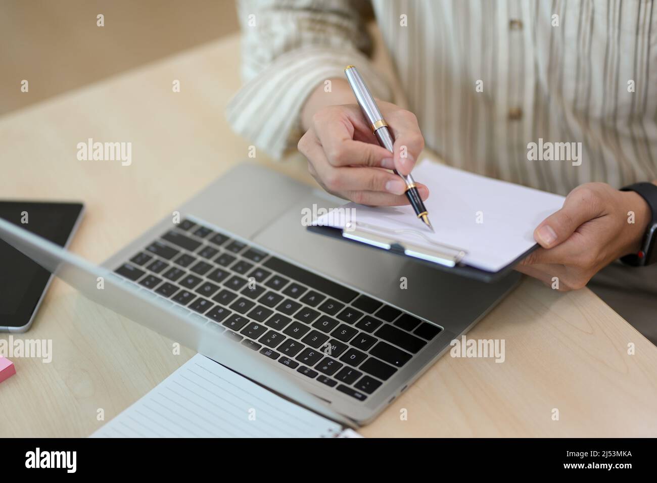 Officer looking up information on laptop hi-res stock photography and ...