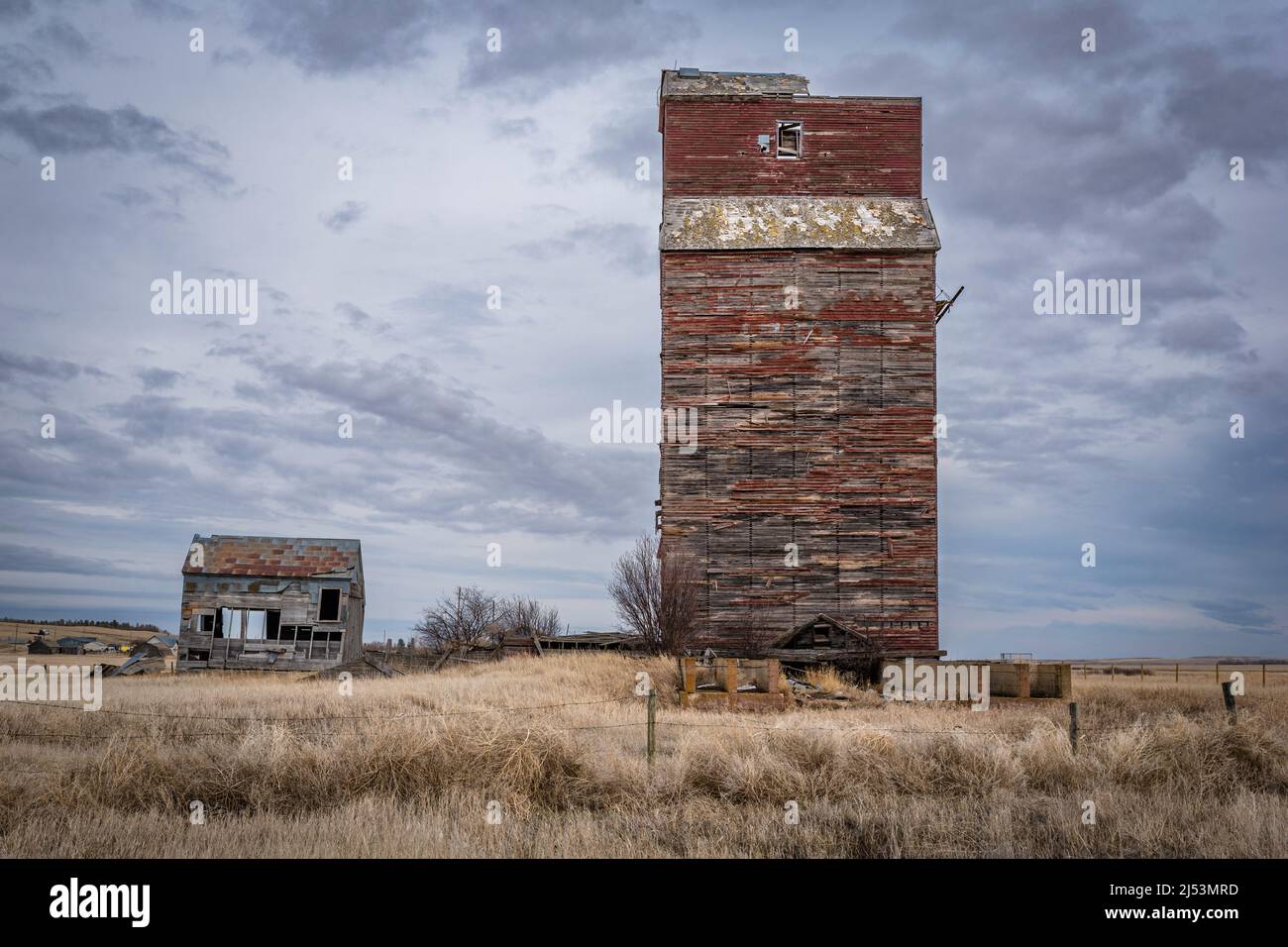Moody skies over an old grain elevator and its office in Neidpath ...