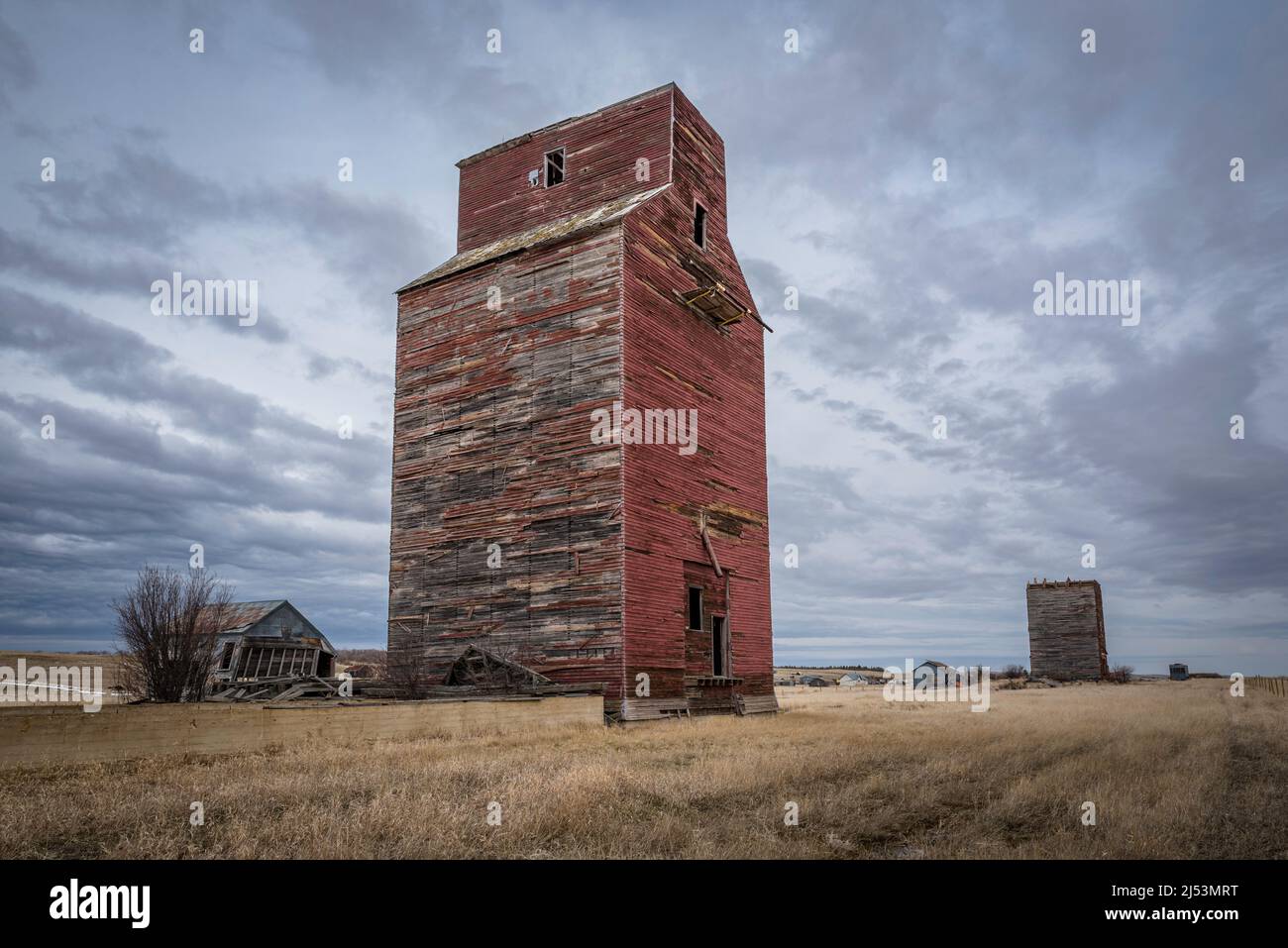 Moody skies over an old grain elevator and its office in Neidpath ...