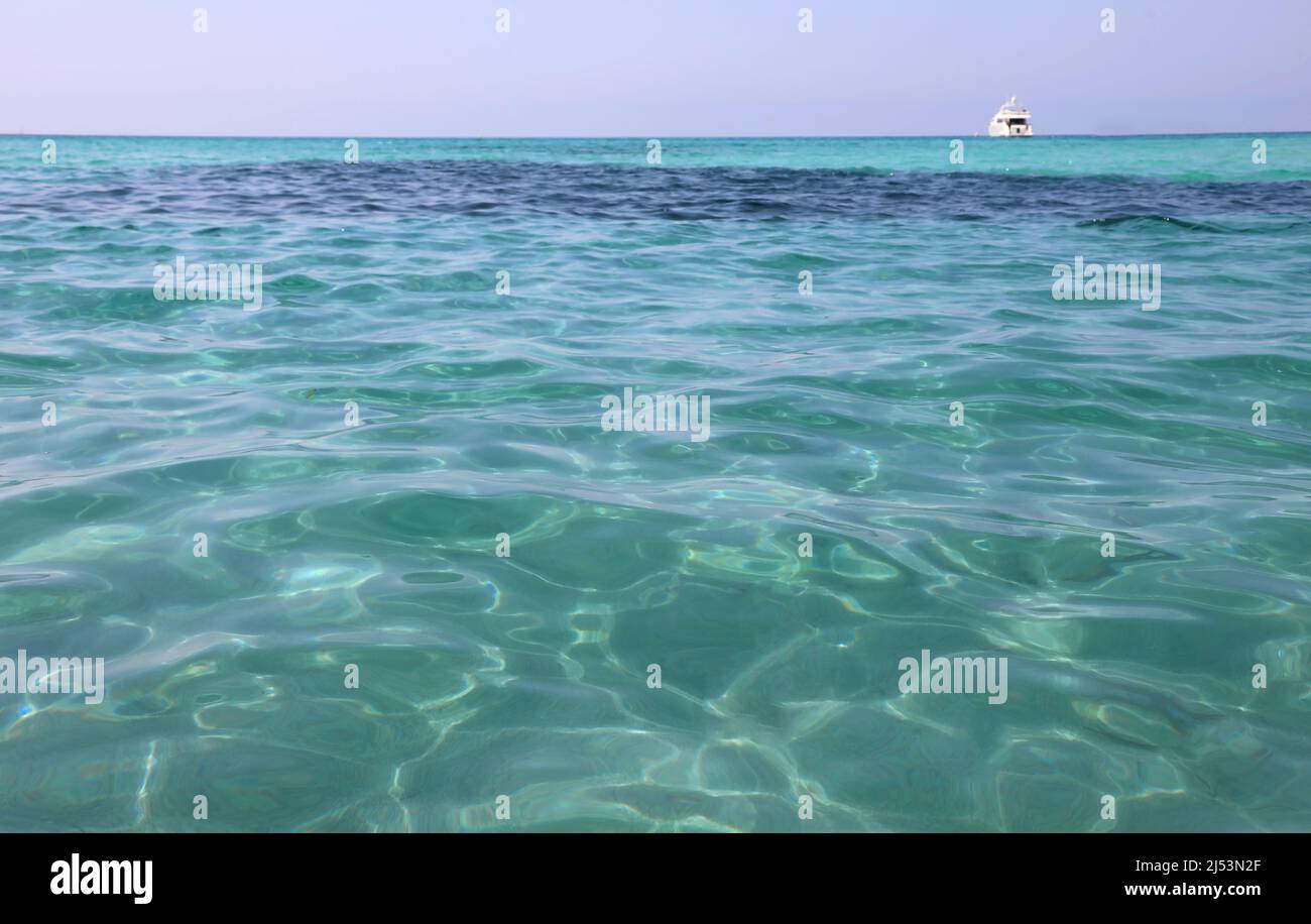 clear clean pristine sea water and at the bottom a yacht of a wealthy ...