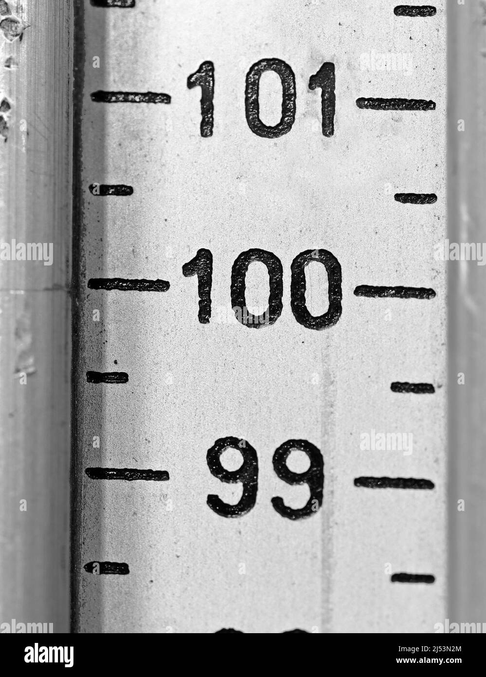 detail of the graduated measuring rod with the number one hundred in ...
