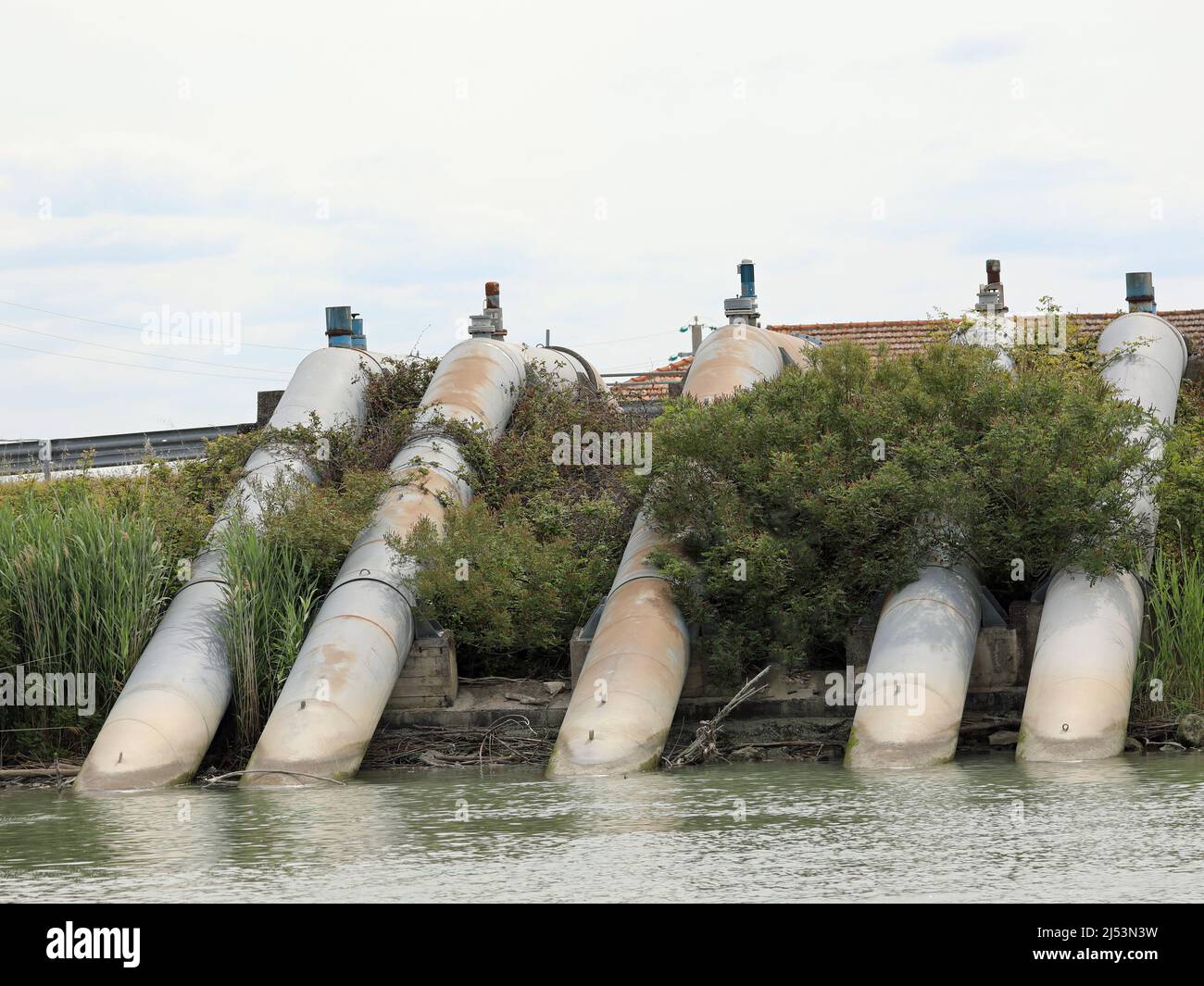 large pipes of a powerful dewatering pump for the suction of water and ...