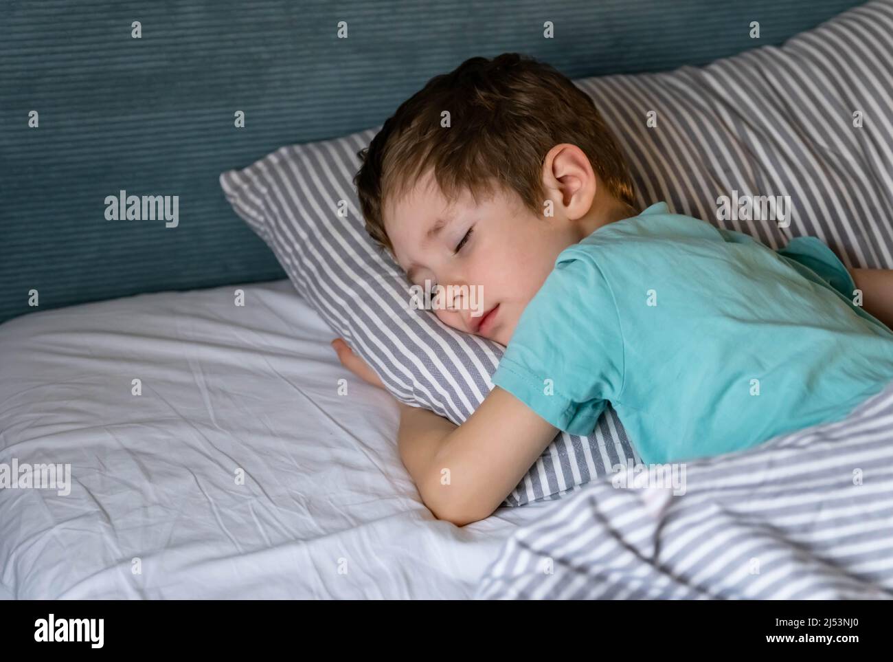 Sleeping child in bed. Little baby napping in the nursery Stock Photo ...
