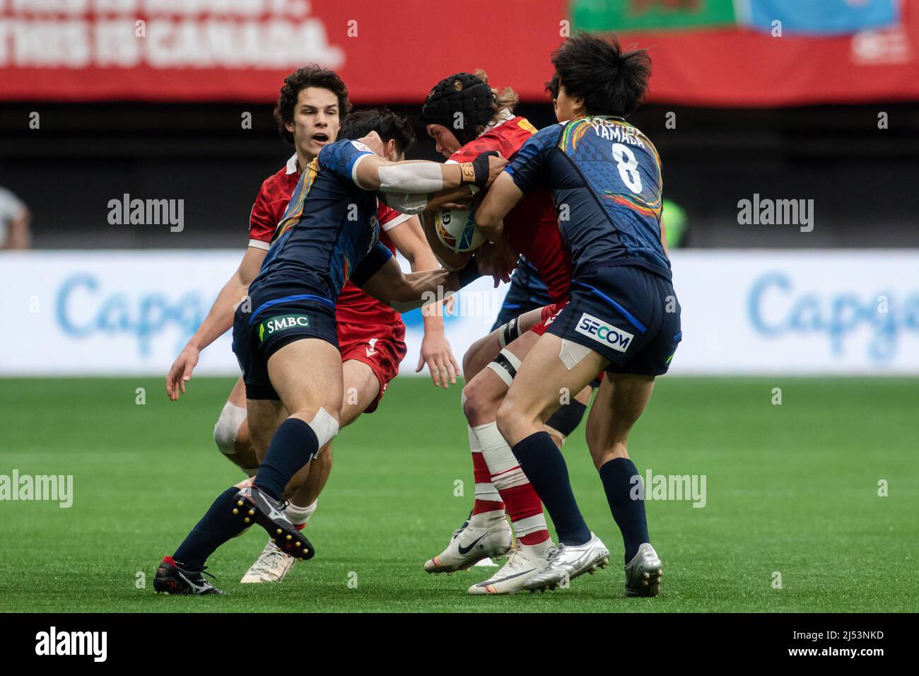 Vancouver, Canada, April 17, 2022: Jake Thiel (middle, holding ball) of ...