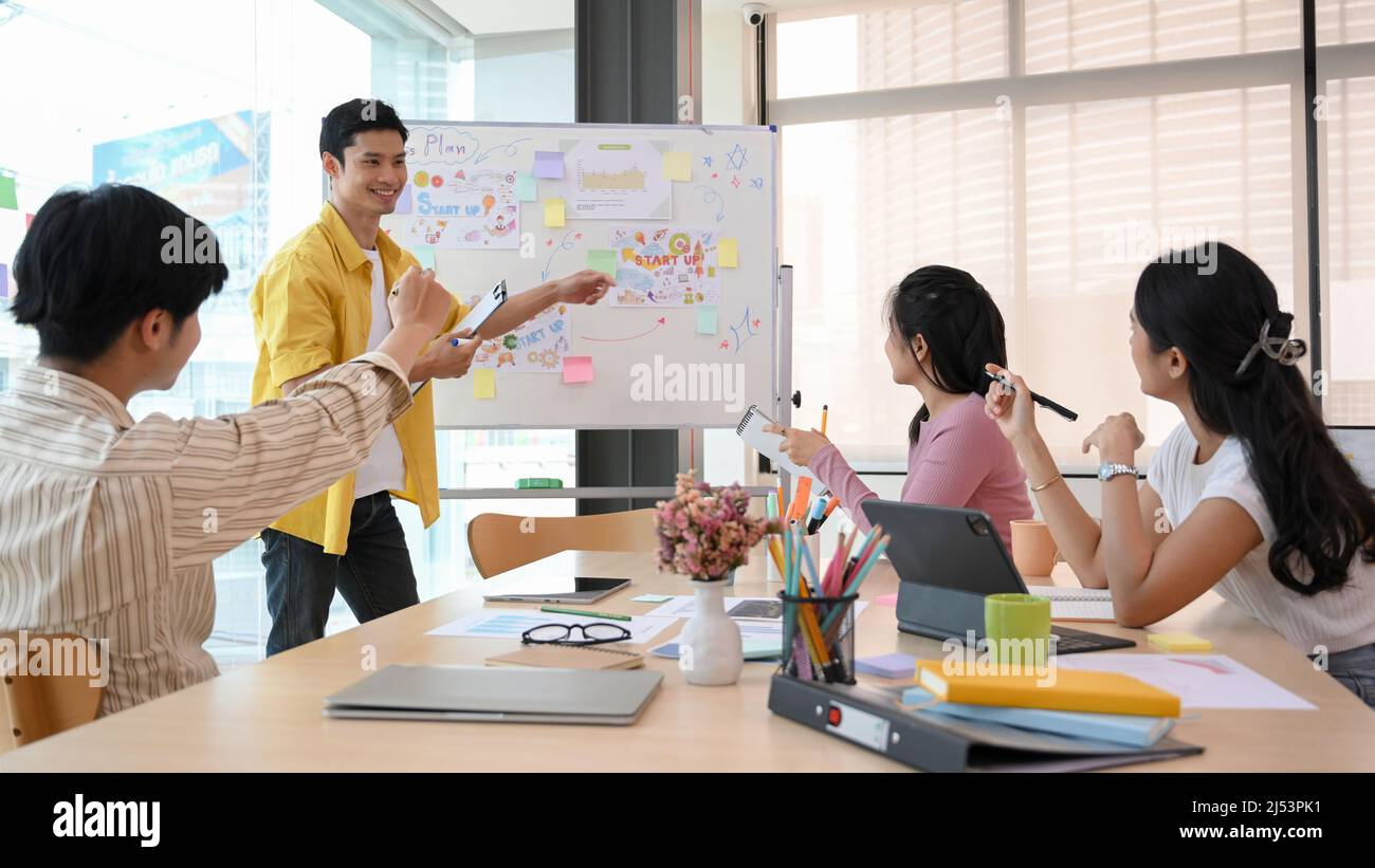 A group of smart business startups are listening to their boss's ...