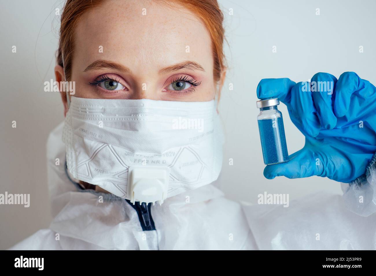 Virologist woman in chemical protection hi-res stock photography and ...