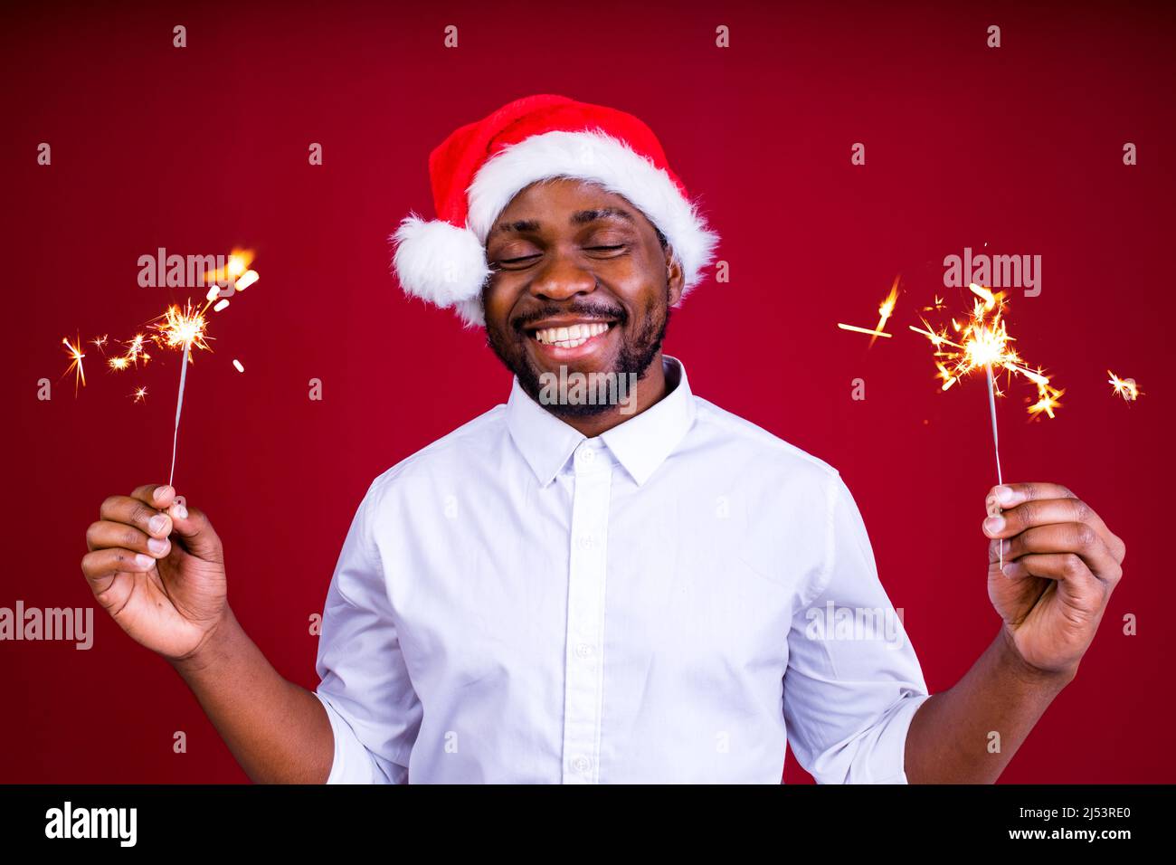 african american man holding a burning stick of dynamite in studio red ...