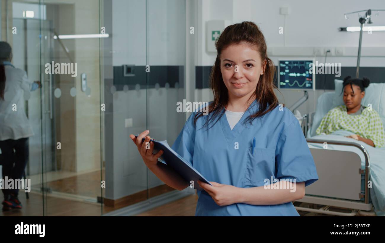 Portrait medical assistant checkup documents hi-res stock photography ...