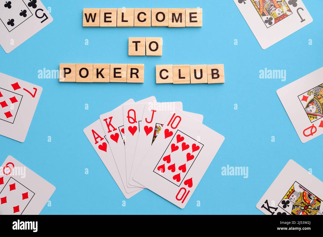 Poker Playing Cards on blue background with wooden blocks. Flatlay ...