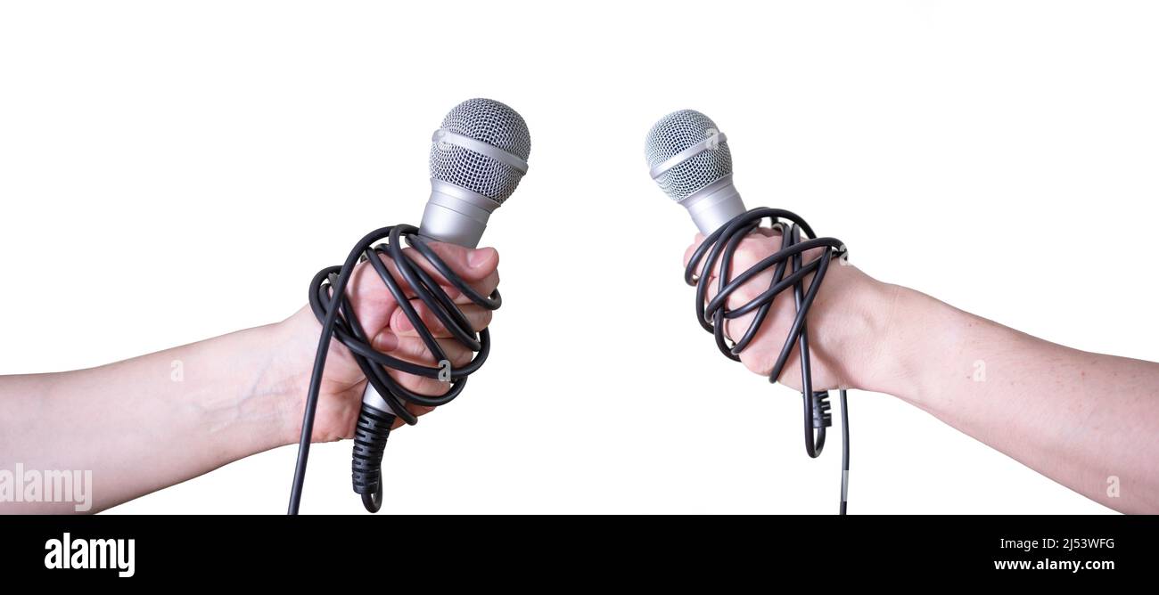 People holding different microphones on white background, closeup. The ...