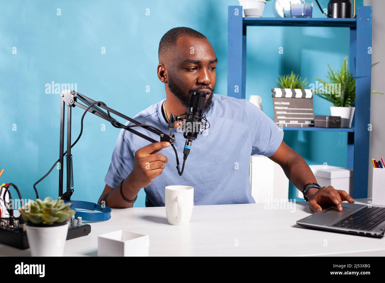 Vlogger answering questions talking at professional microphone in ...