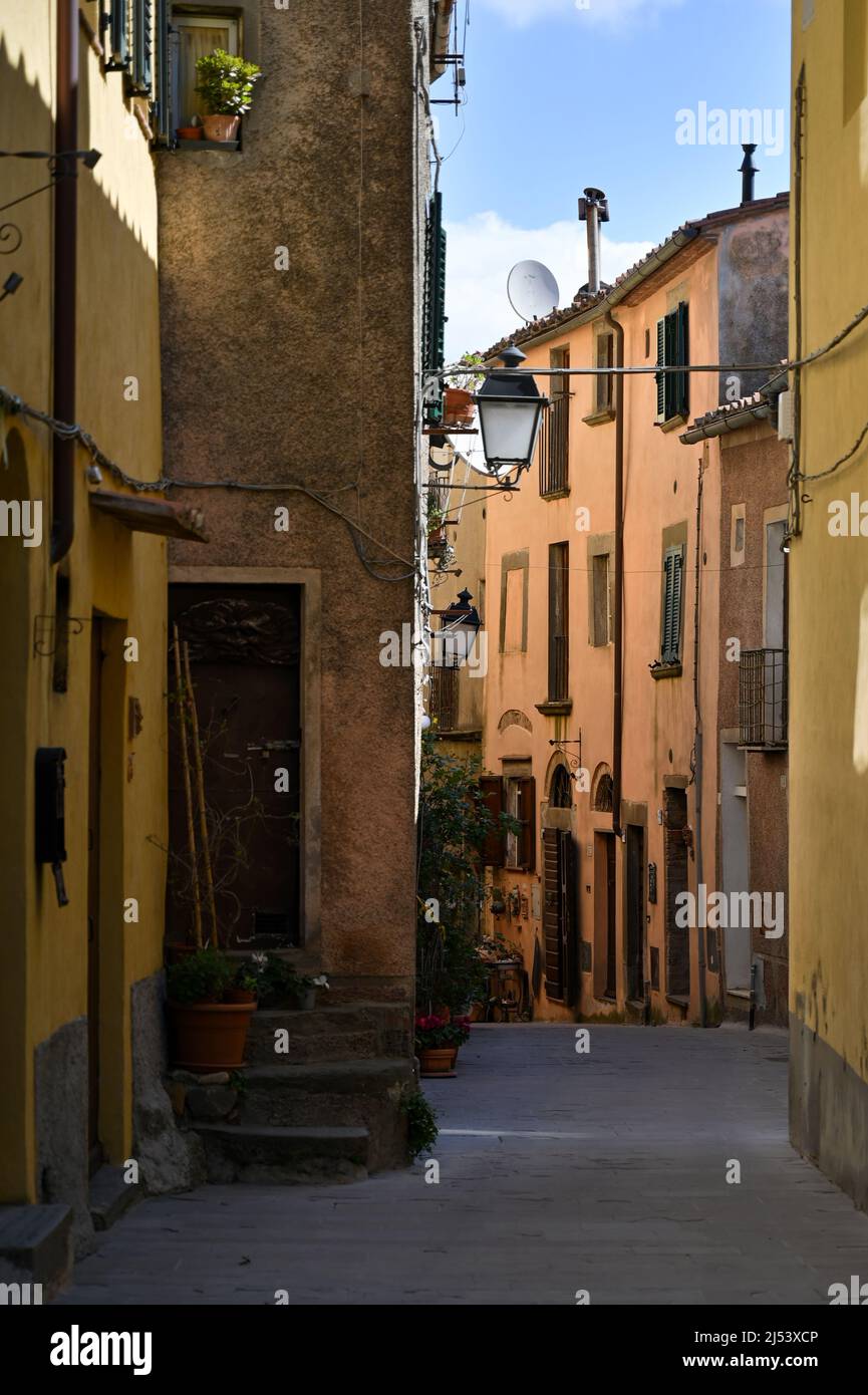 A quiet residential street in the historic medieval village of Scansano ...
