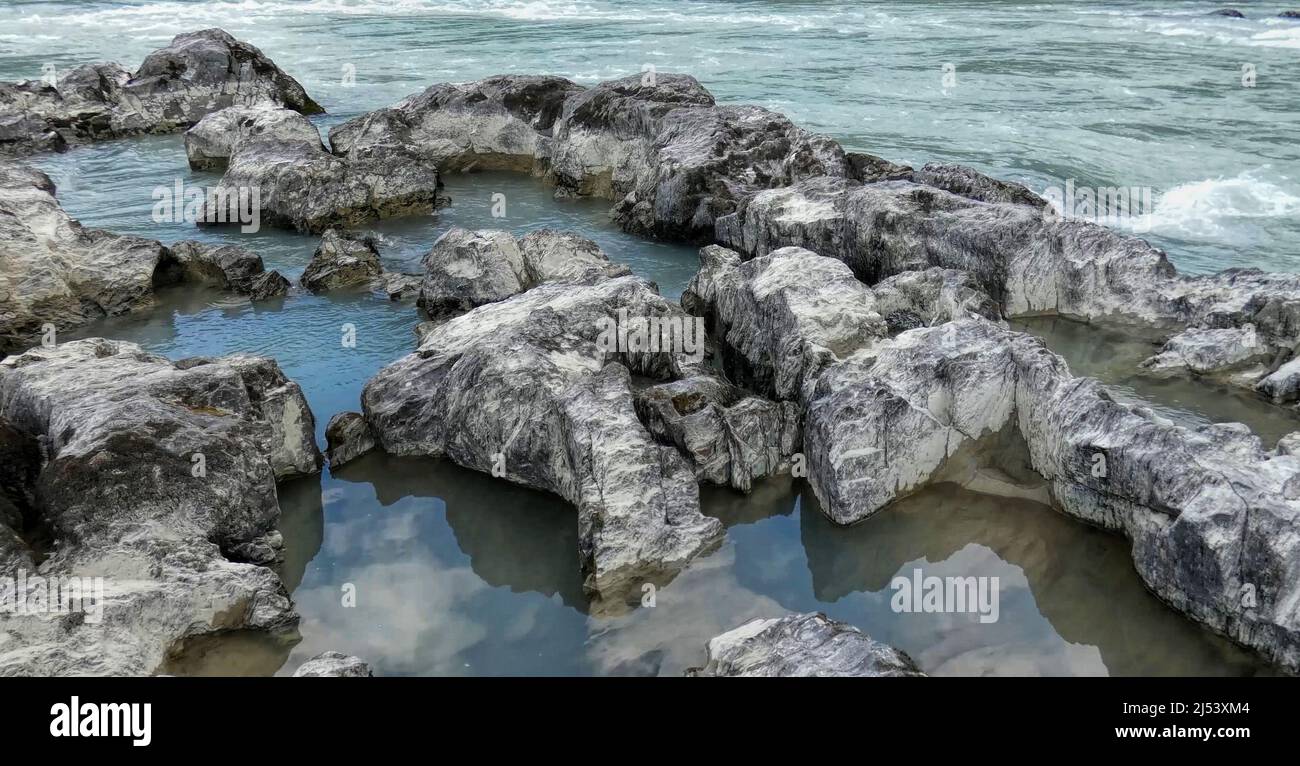 Wild mountain river. Fast water stream moving among stones Stock Photo ...