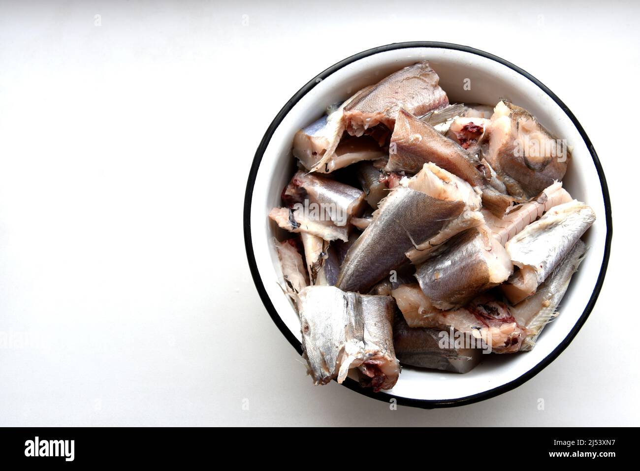 Pieces of raw Whiting fish for frying in a saucepan Stock Photo - Alamy