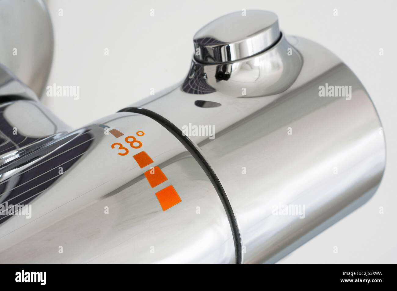 Setting the water temperature in a modern shower fitting Stock Photo ...