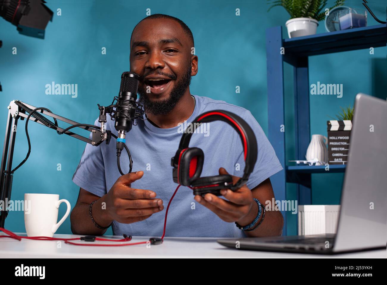 Famous influencer announcing into microphone giveaway winner of a pair ...