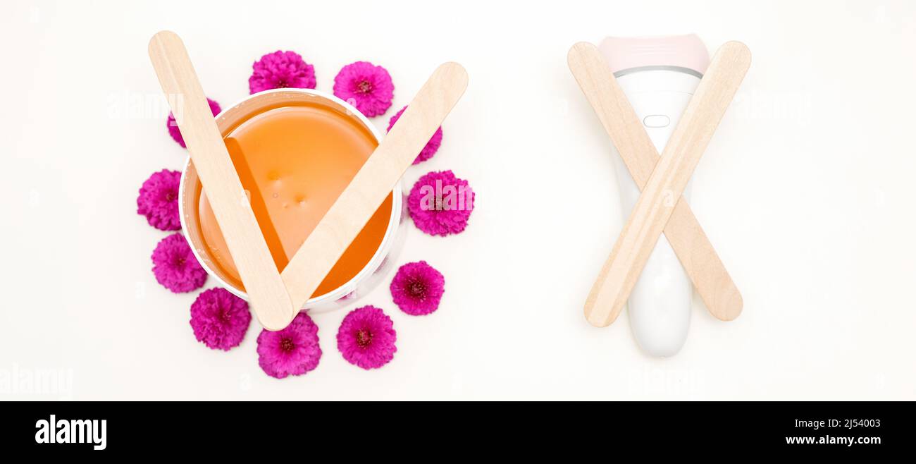 Waxing, depilation concept. Flat lay of the white cosmetic jar with ...
