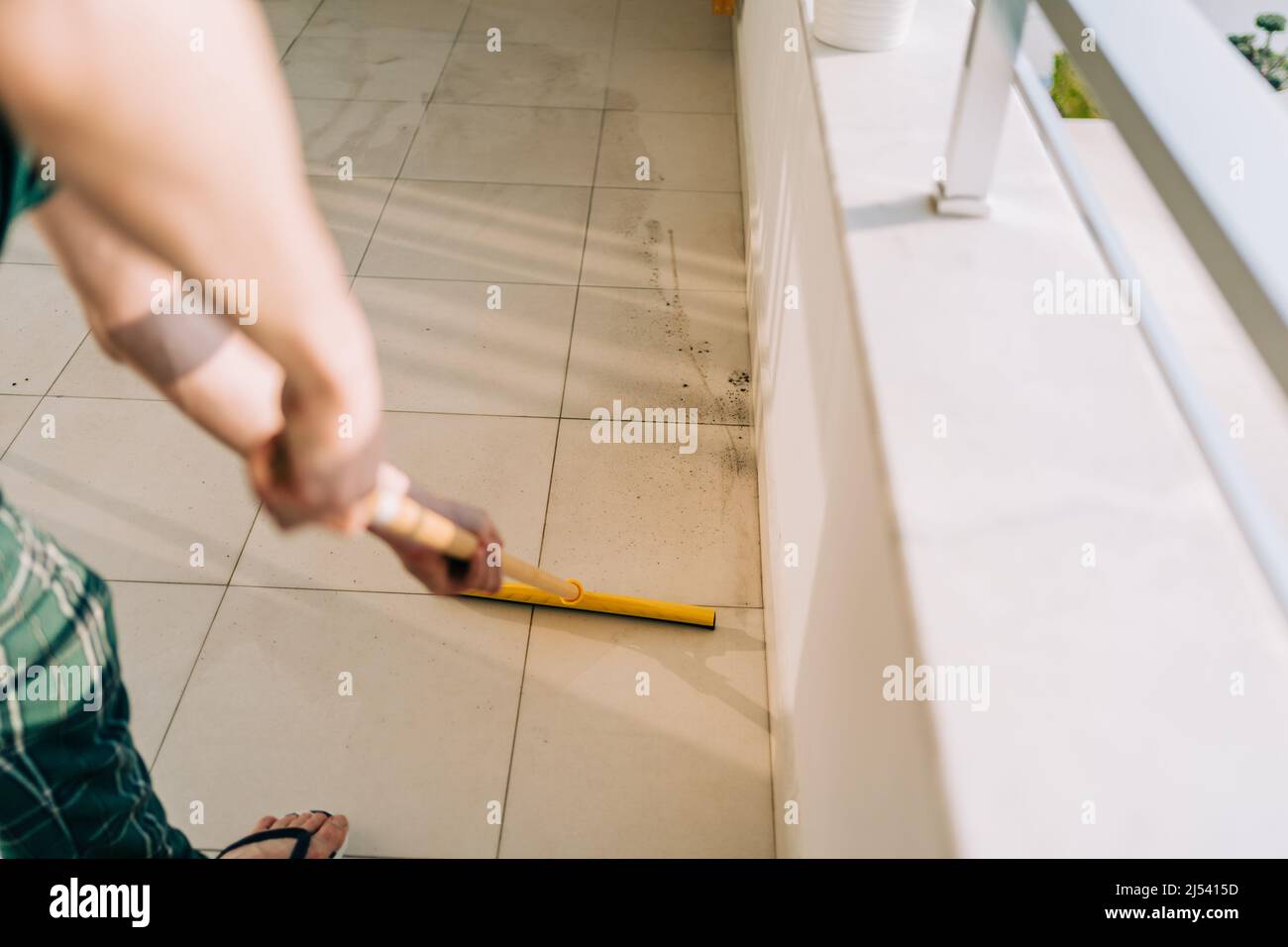 Man wiping floor with the mop. Janitor washing the dirty floors. Guy ...