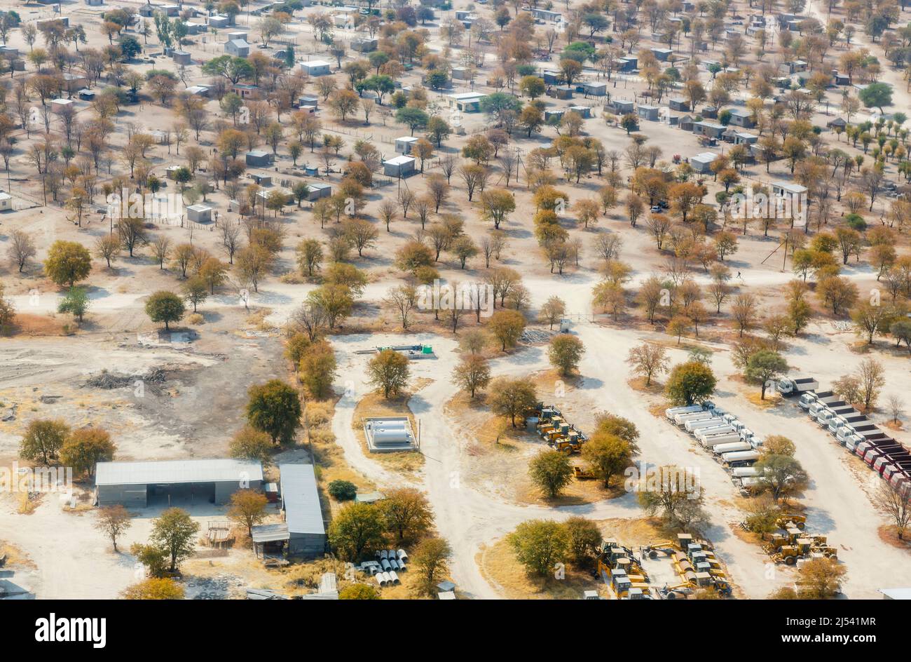 Aerial view over a township and industrial area en route to the Moremi ...